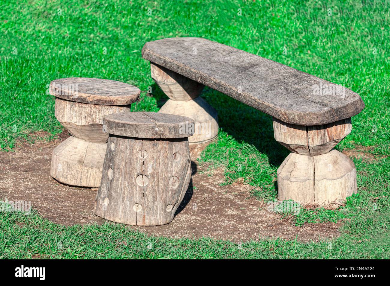 Wooden seats and table on the grass . Place for picnic Stock Photo - Alamy