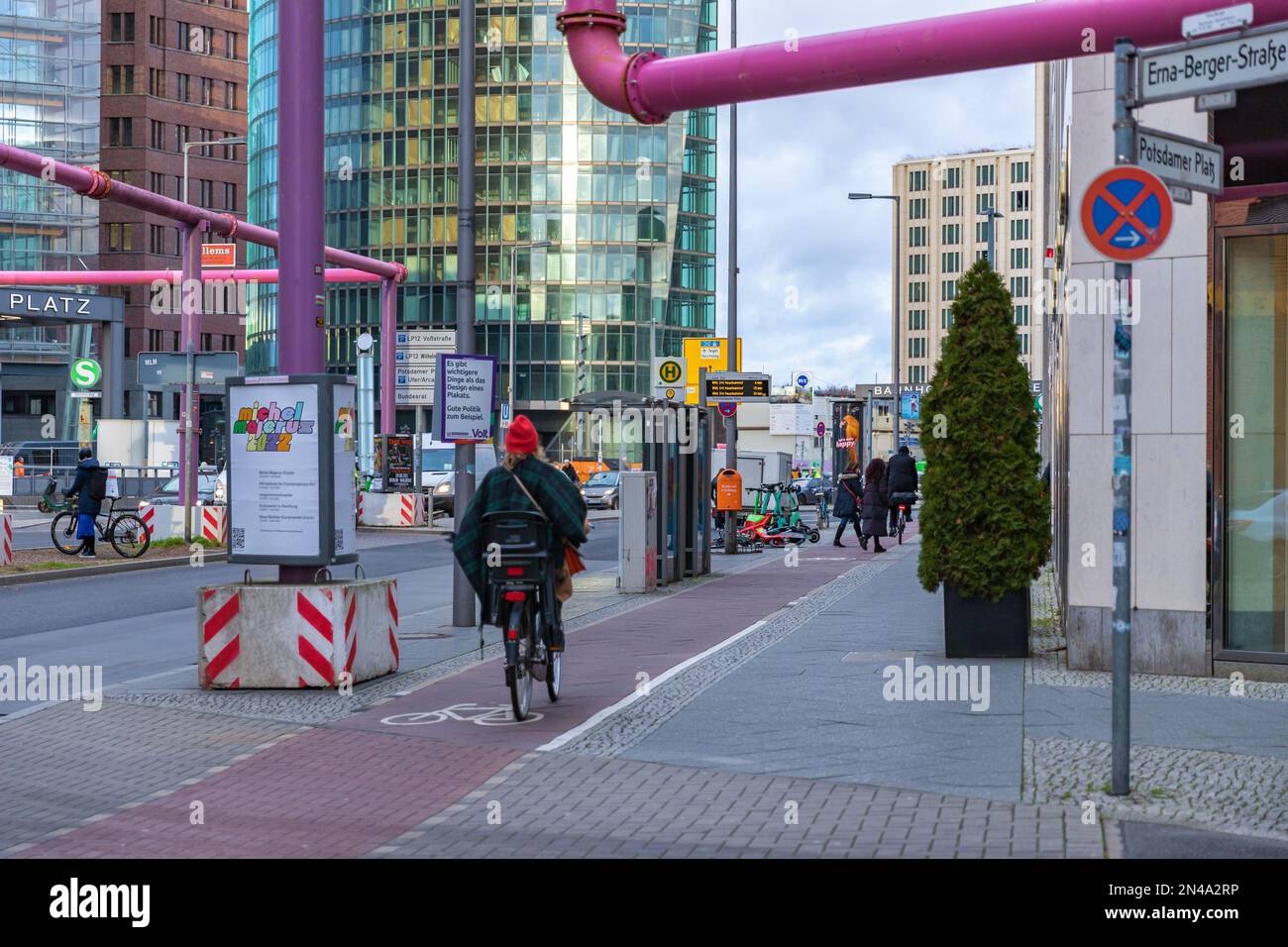 A bike path or a cycle path in Berlin, Germany. People and cyclists on ...