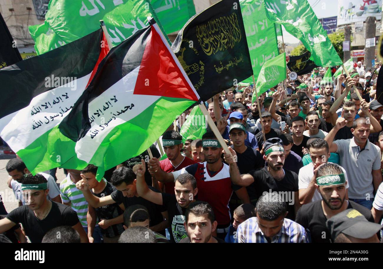 Palestinian supporters of Hamas and the Islamic Jihad movement chant ...