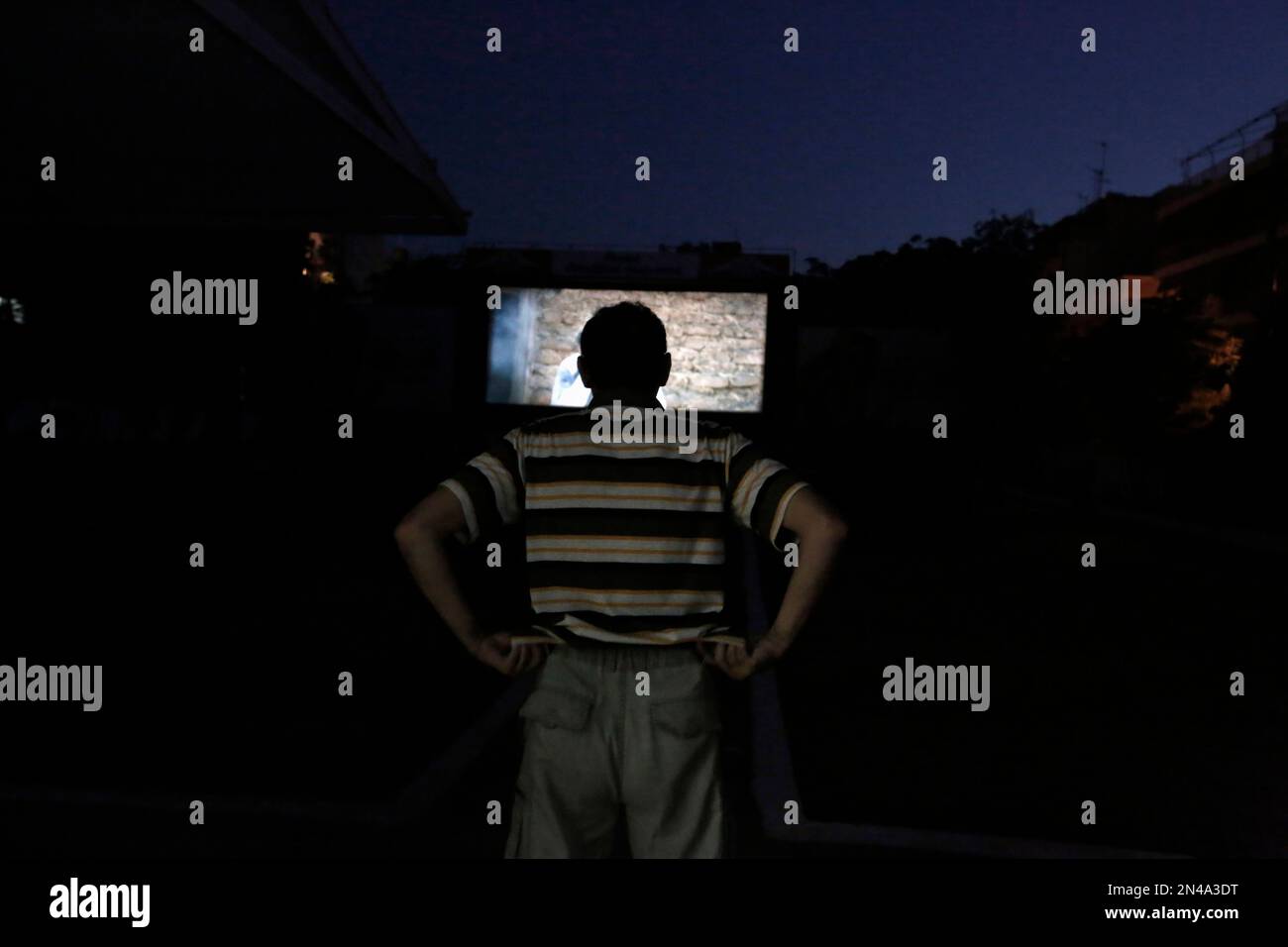 In this July 29, 2014 photo, a cinema technician stands in front of the ...