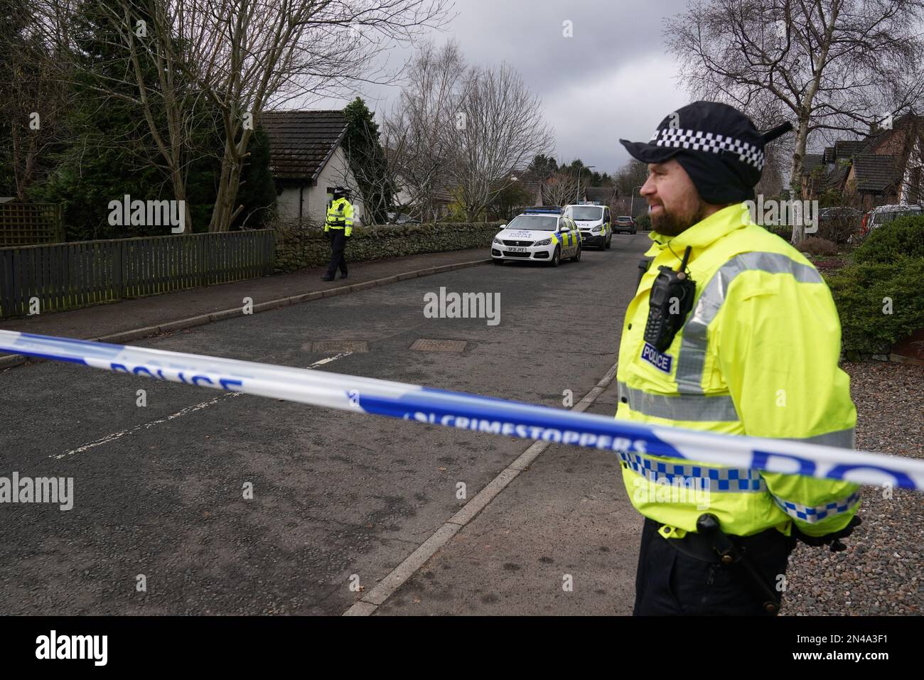 Police officers patrol a cordon in Montgomery Terrace in Gattonside ...