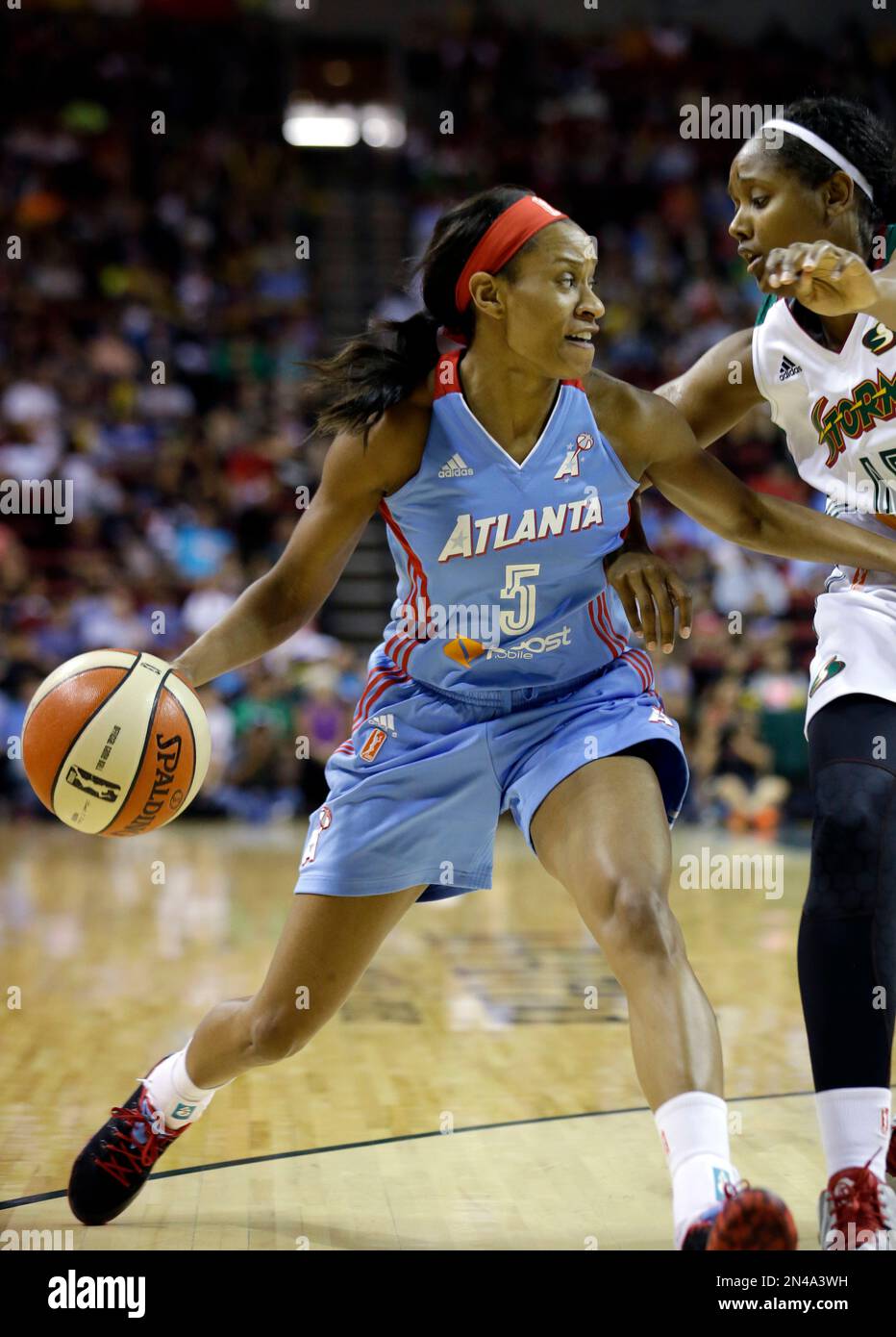 Atlanta Dream's Jasmine Thomas in action against the Seattle Storm in a ...