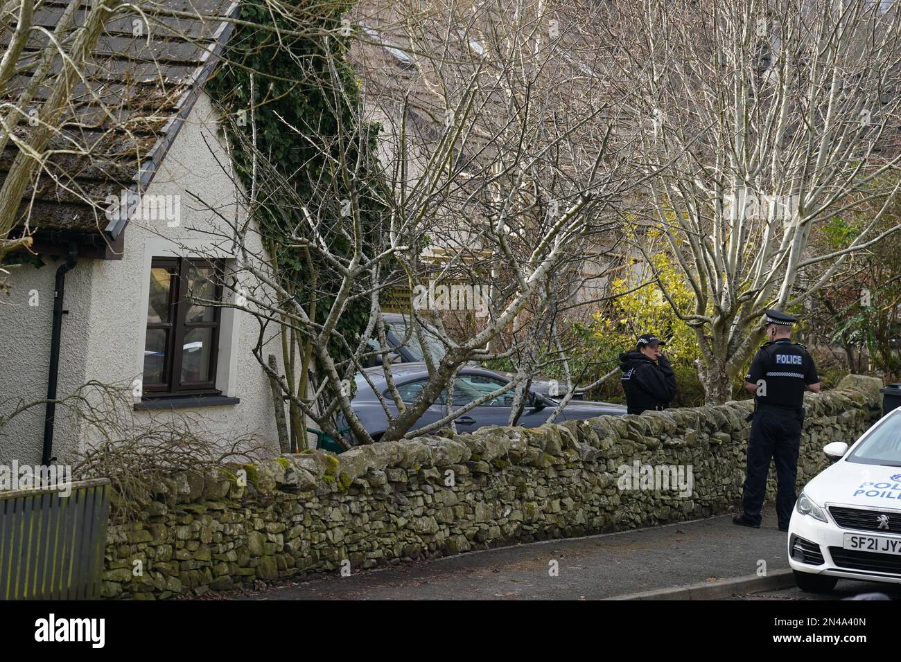 Police officers in the garden of a property on Montgomery Terrace in ...