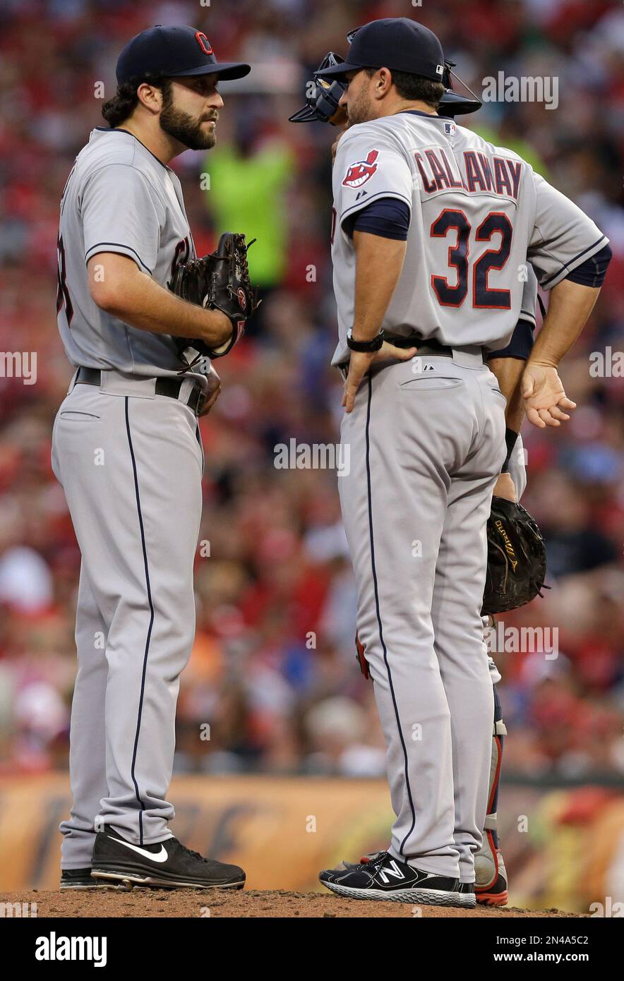 Cleveland Indians starting pitcher T.J. House talks with pitching coach ...