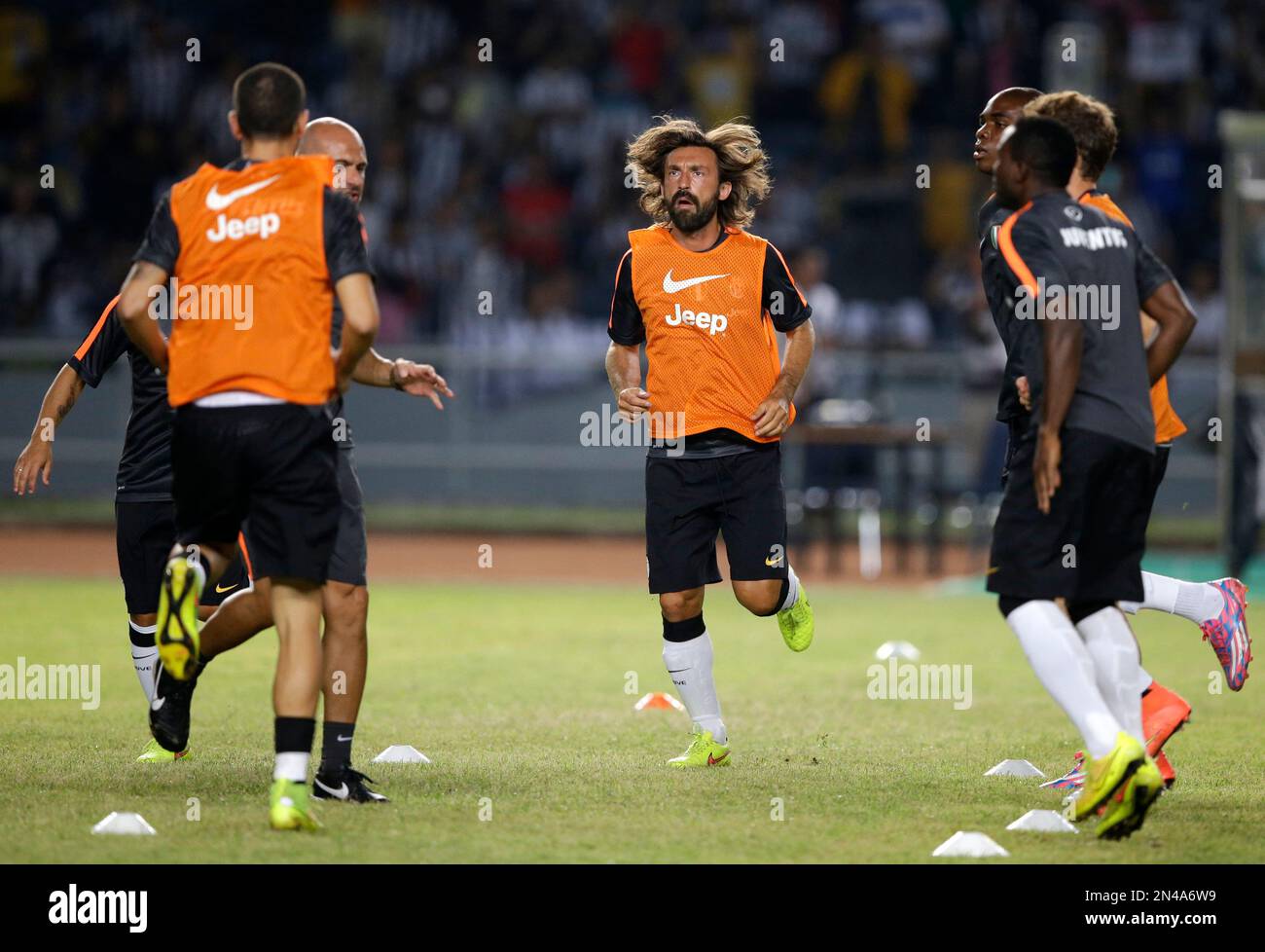 Juventus' Andrea Pirlo, center warms up with his team mates prior to a ...