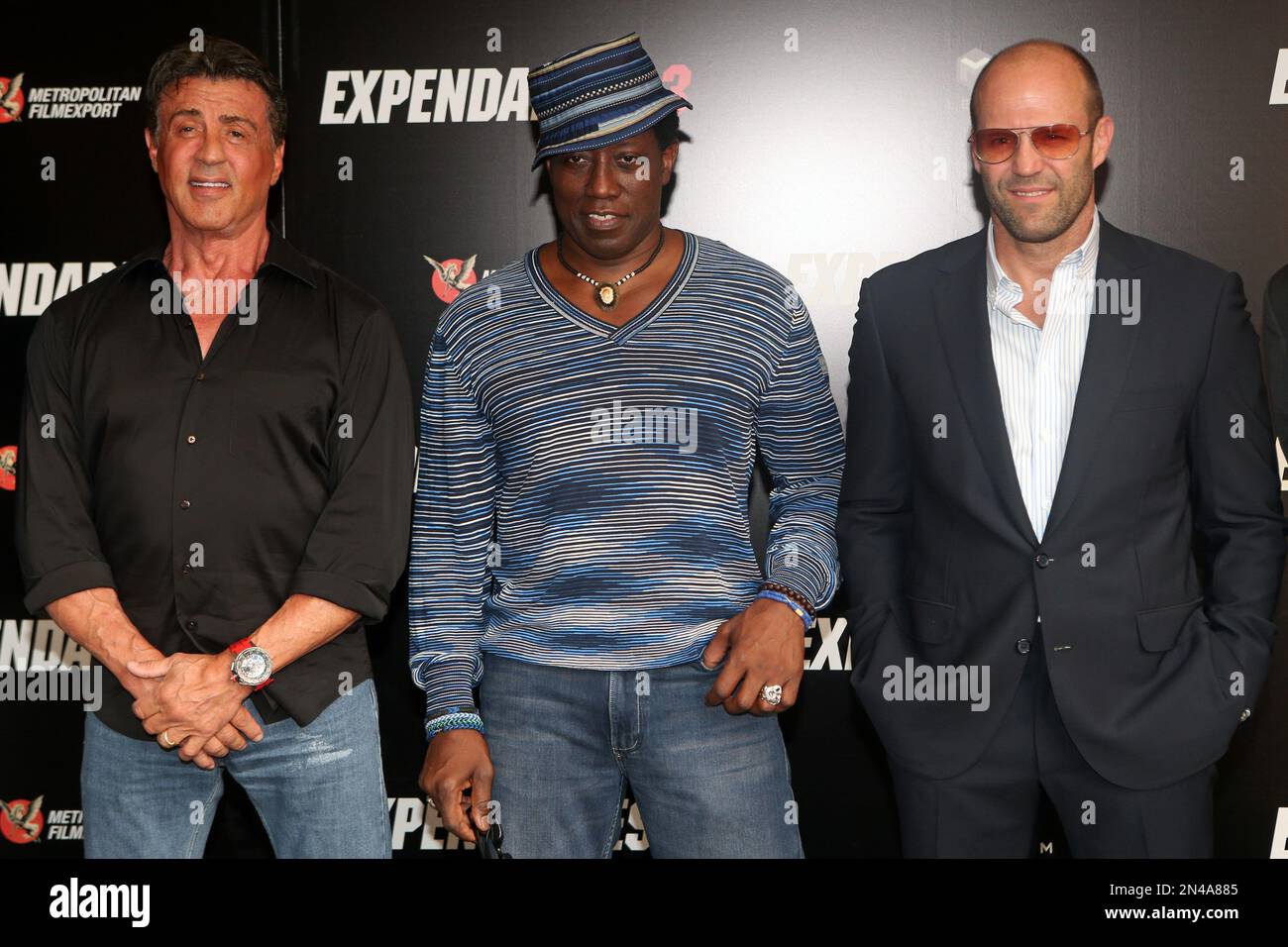 From left, actors Sylvester Stallone, Wesley Snipes, and Jason Statham ...