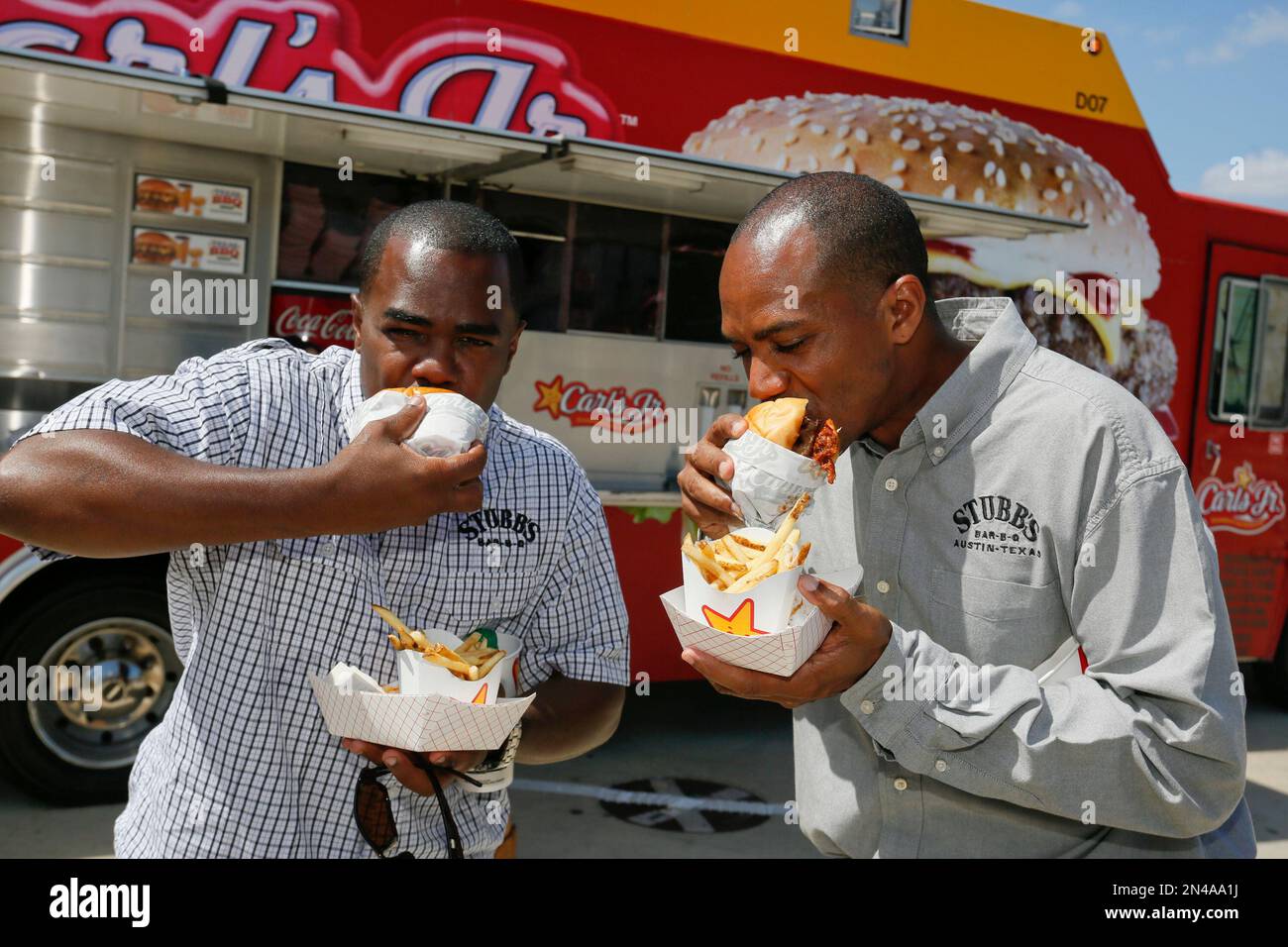 Reggie Stubblefield, left, and Rocky Stubblefield try out Carl's Jr.'s ...