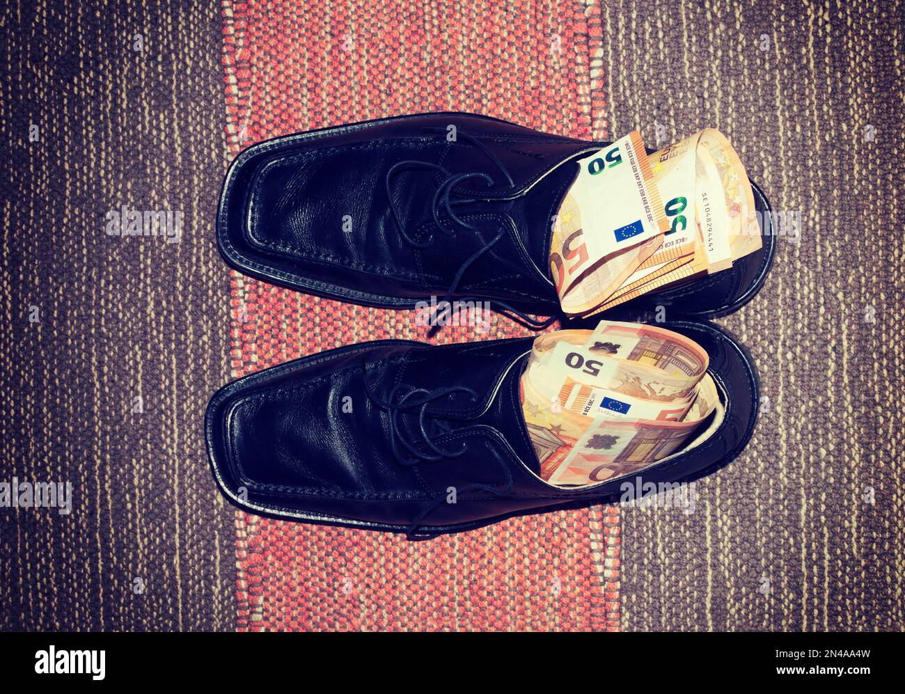 men's shoes with euro notes inside Stock Photo - Alamy