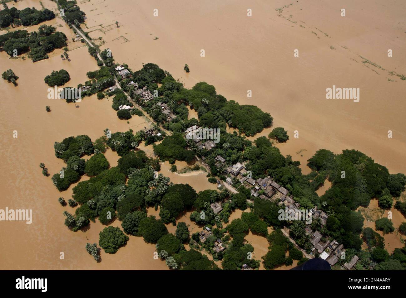 An aerial view shows villages partially submerged by monsoon floods in ...