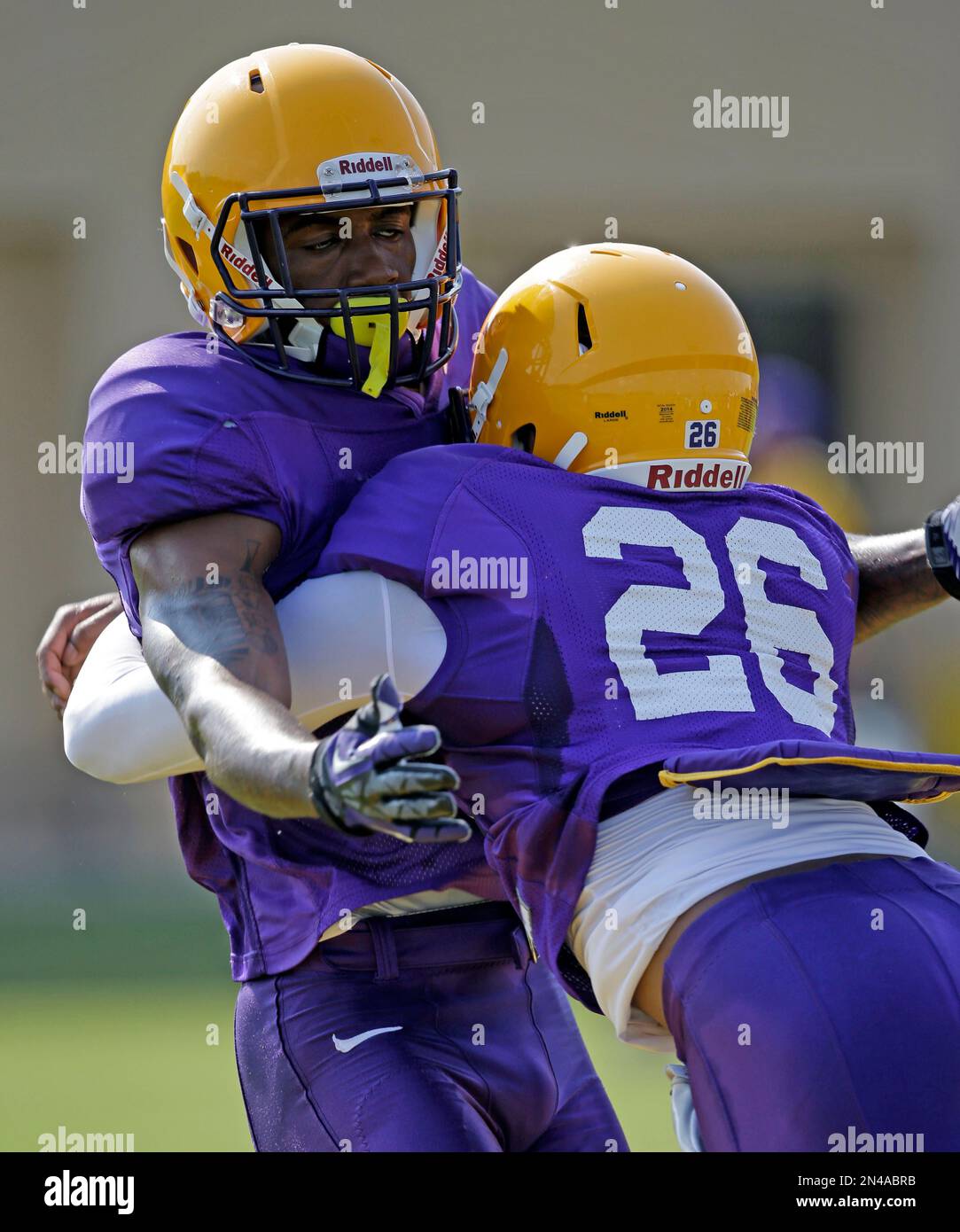 LSU safety Jalen Mills (28) and safety Ronald Martin (26) run through ...