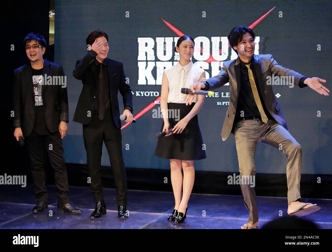 The cast of the Japanese film "Rurouni Kenshin", from left, director ...