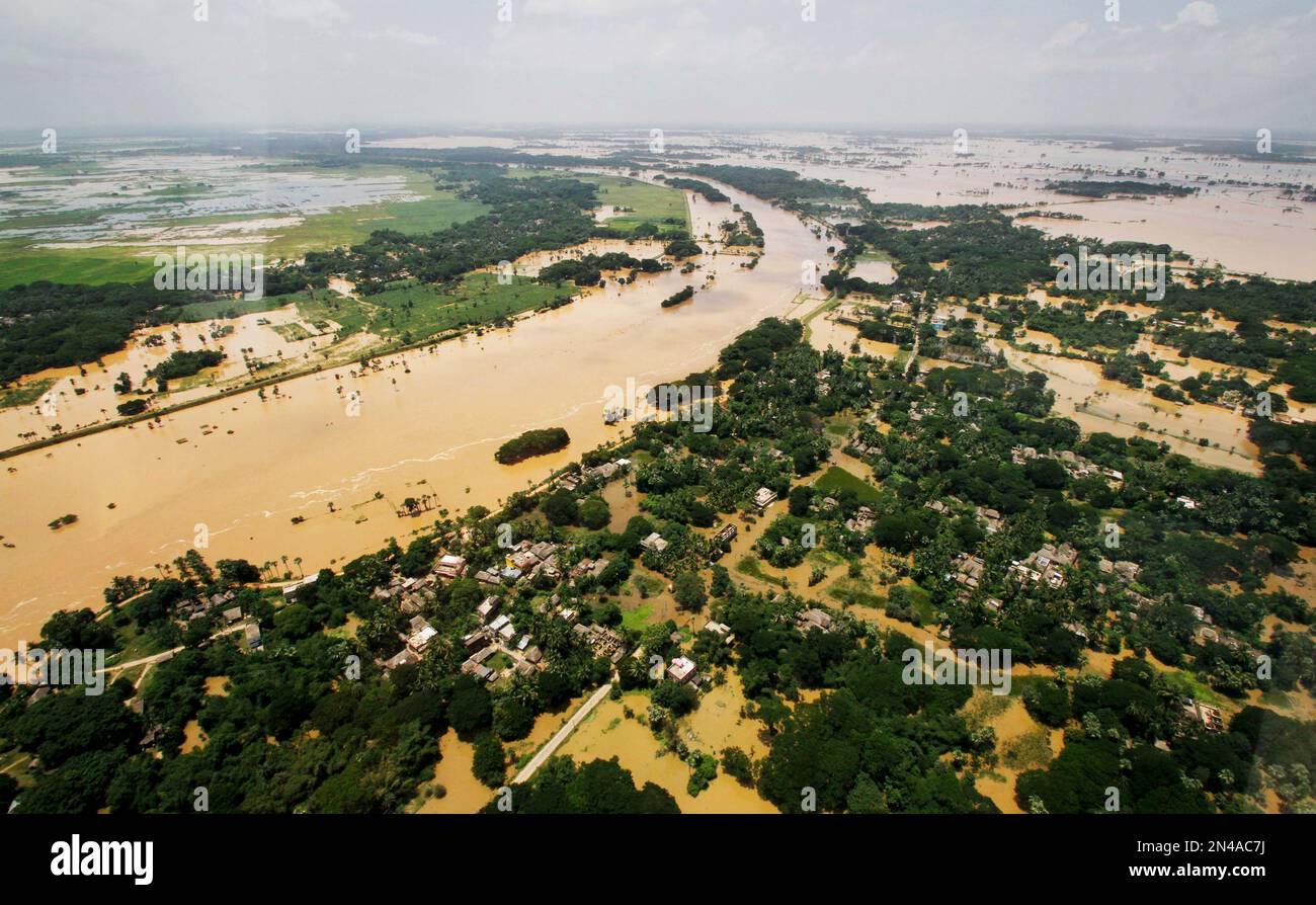 An aerial view shows villages partially submerged by monsoon floods in ...