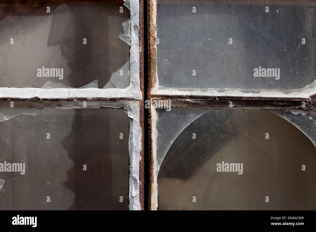 Broken window panes with a human-like screaming face Stock Photo - Alamy
