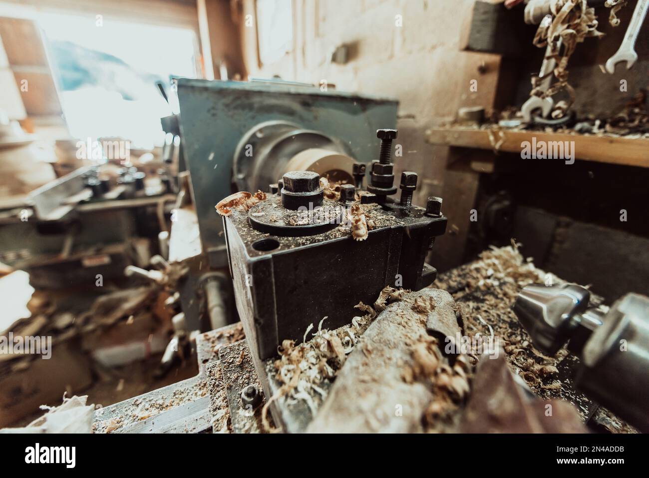 Close-up photo of a lathe working on wood. Mechanical processing of ...