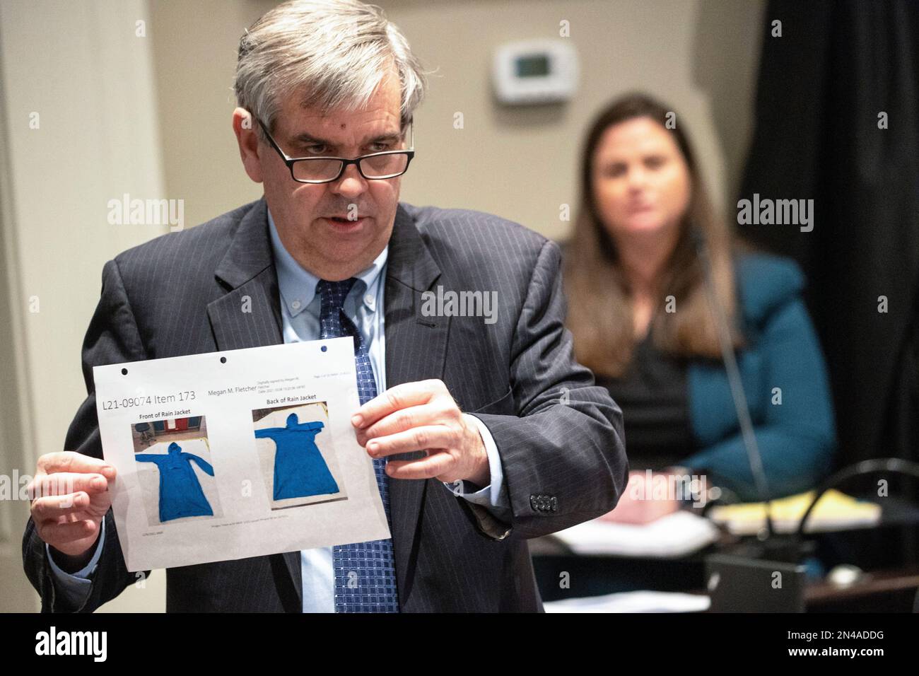Prosecutor John Meadors holds up photos of a blue jacket during Alex ...