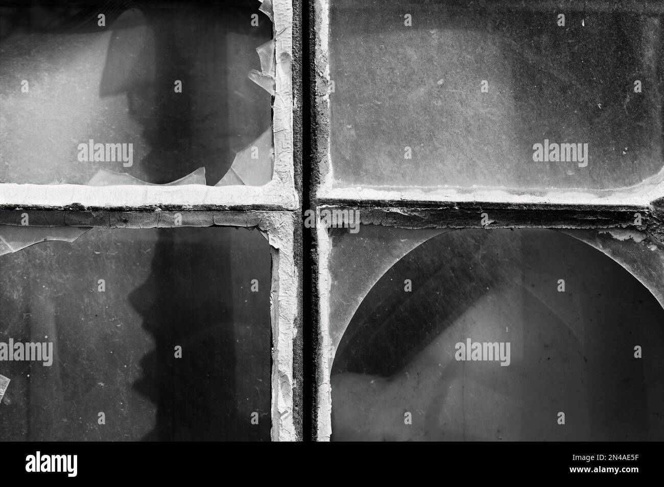 Broken window panes with a human-like screaming face Stock Photo - Alamy