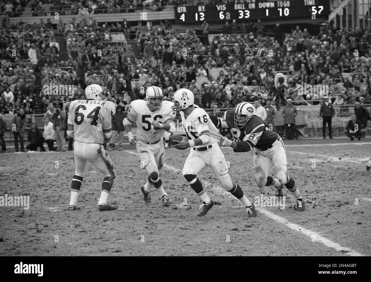 Jim Plunkett, quarterback of the New England Patriots, has his jersey ...