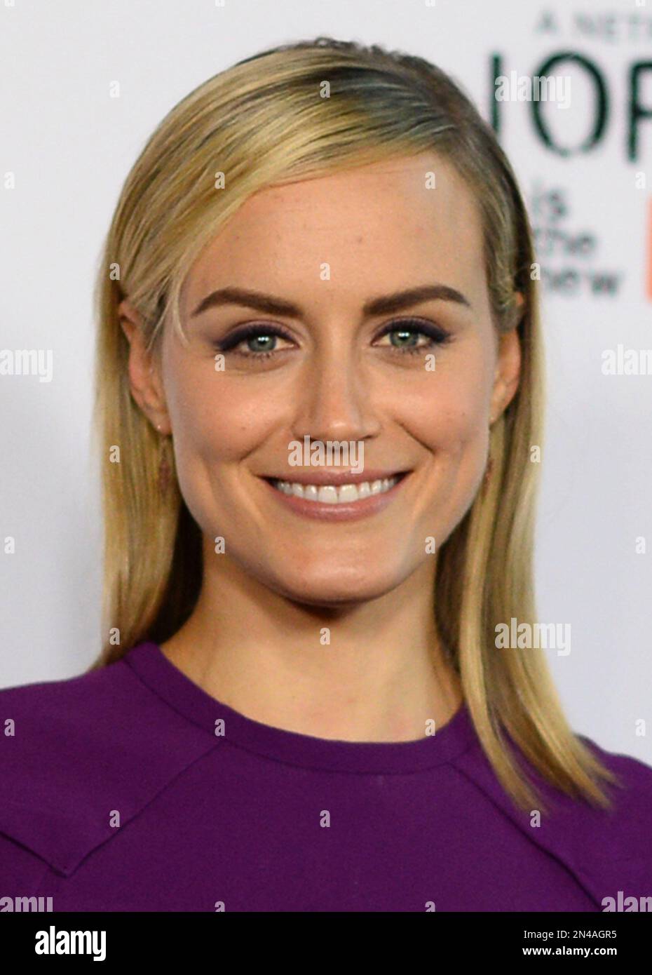 Taylor Schilling arrives at a panel discussion with the cast of "Orange ...