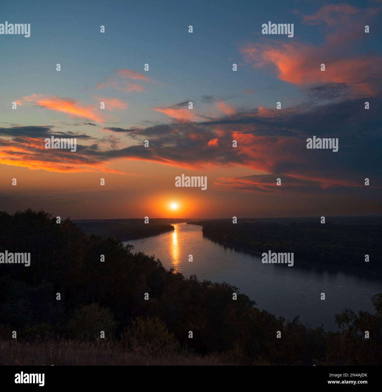 Aerial view of sunset river. Drone flying over the river at dawn with ...