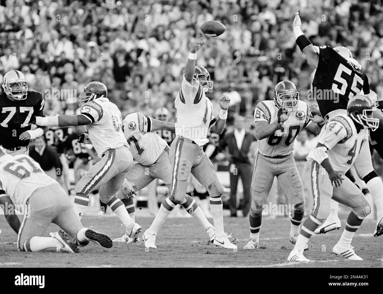 San Diego Chargers quarterback Dan Fouts gets off a pass under the rush ...