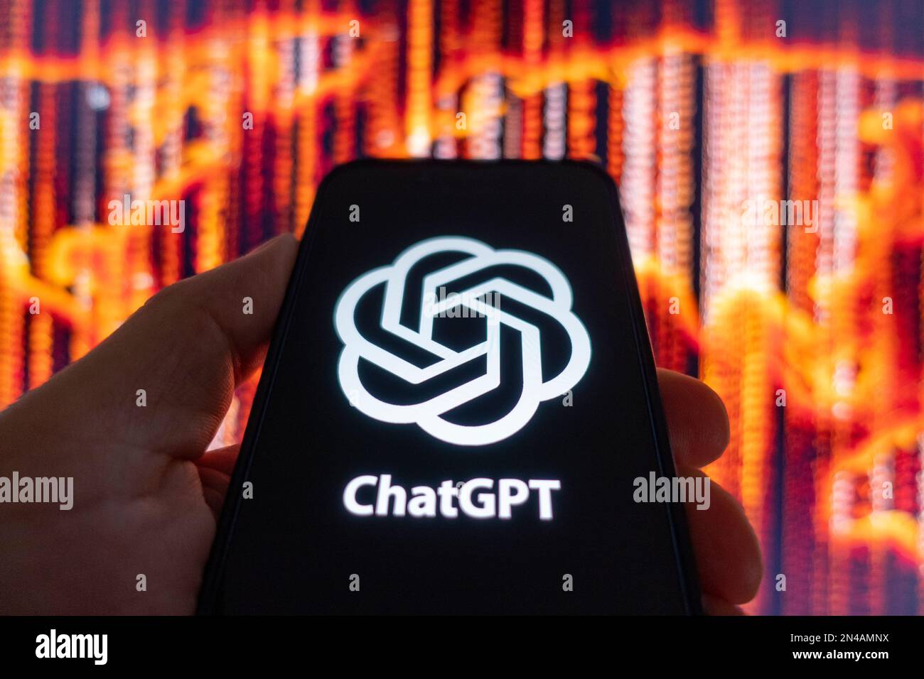 Digital composite image of OpenAI ChatGPT chatbot logo shown on mobile ...