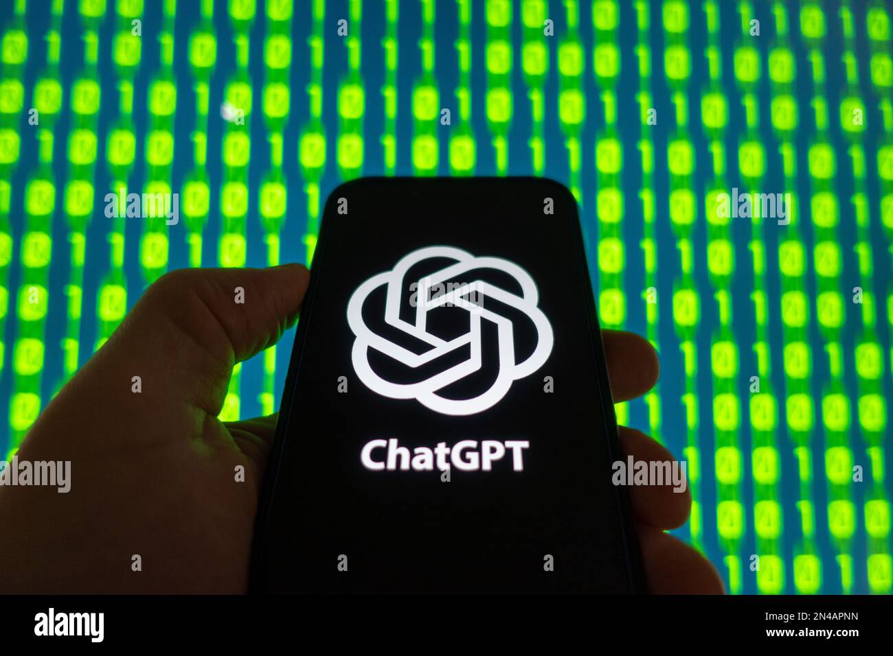 Digital composite image of OpenAI ChatGPT chatbot logo shown on mobile ...
