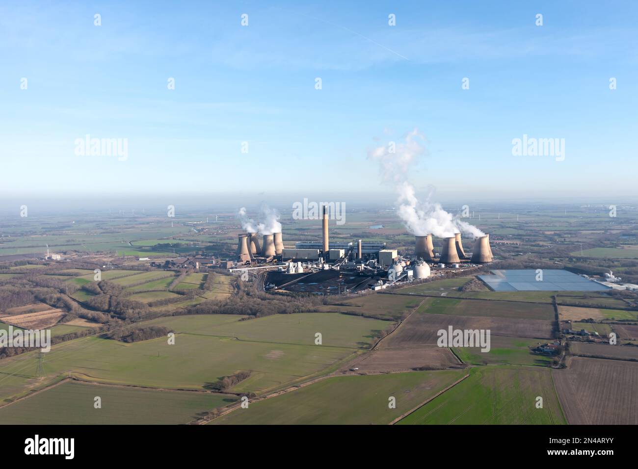 Aerial landscape view of Drax Power Station in North Yorkshire with smoking chimneys and cooling ...