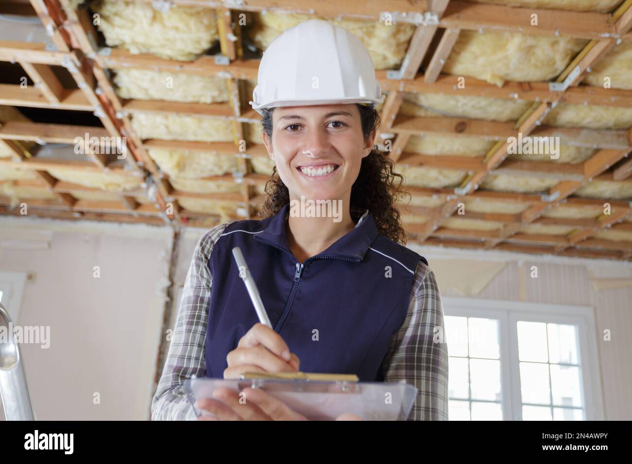woman builder taking notes at construction site Stock Photo - Alamy