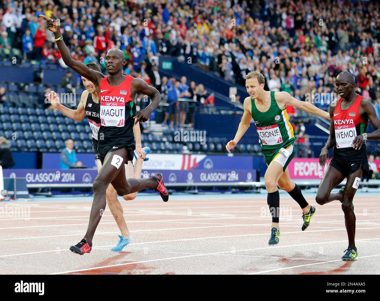 James Magut of Kenya celebrates as he crosses the finish line to win ...