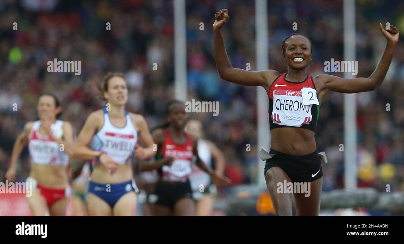 Mercy Cherono of Kenya celebrates after she crossed the line to win the ...