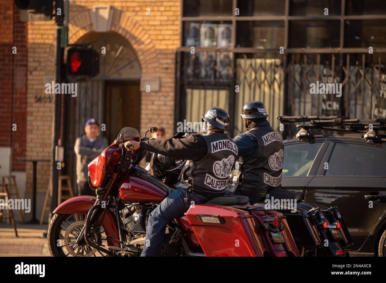 The two California Mongols bikers riding motorcycles on an open road ...