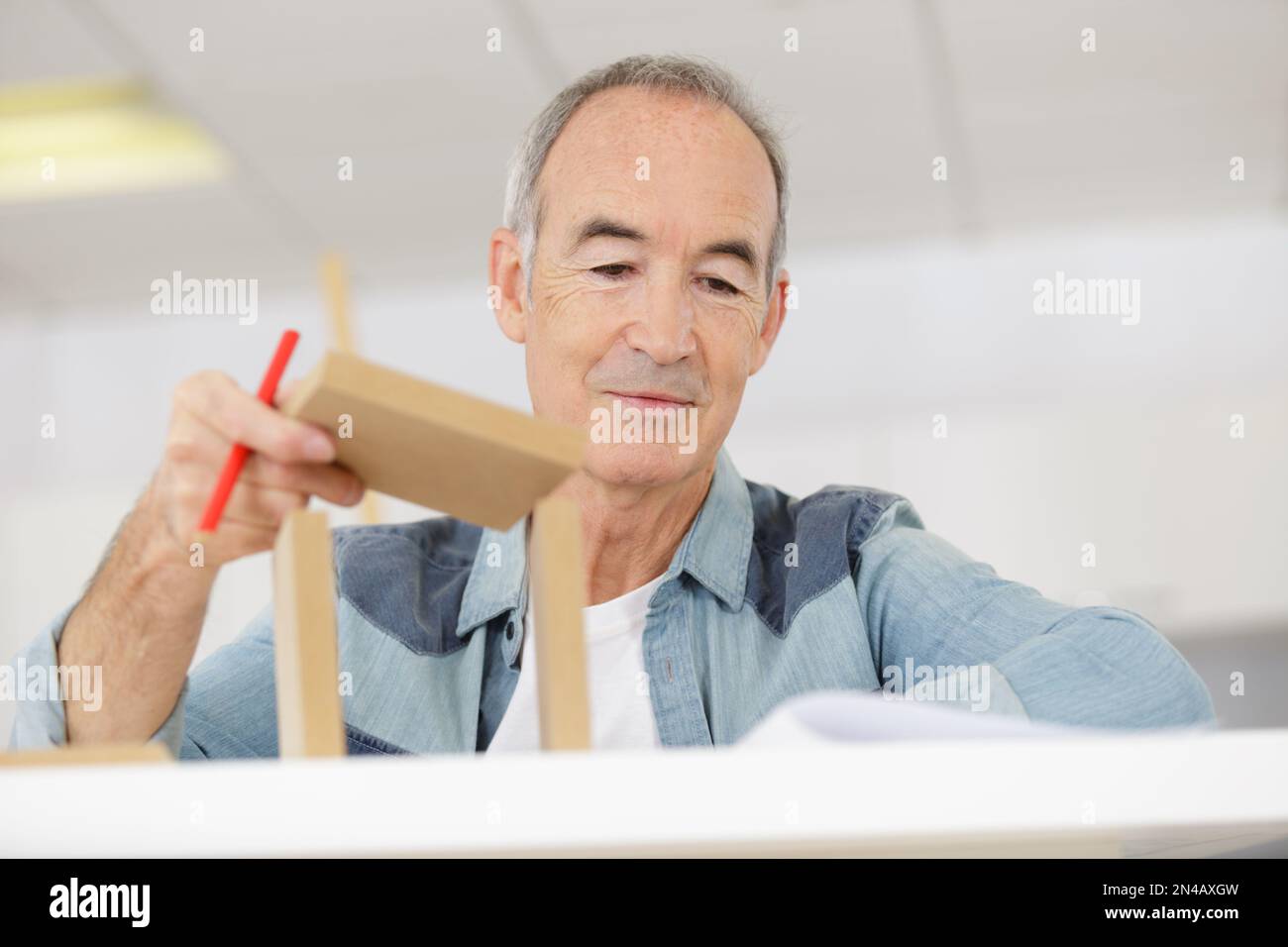 Senior handyman working on hi-res stock photography and images - Alamy