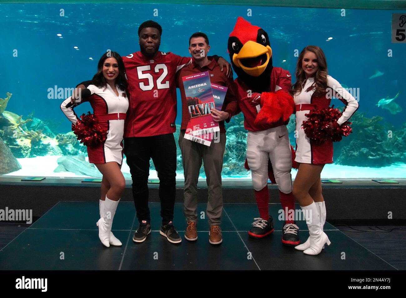 Aaron Marquez pose with Arizona Cardinals linebacker Victor Dimukeje ...