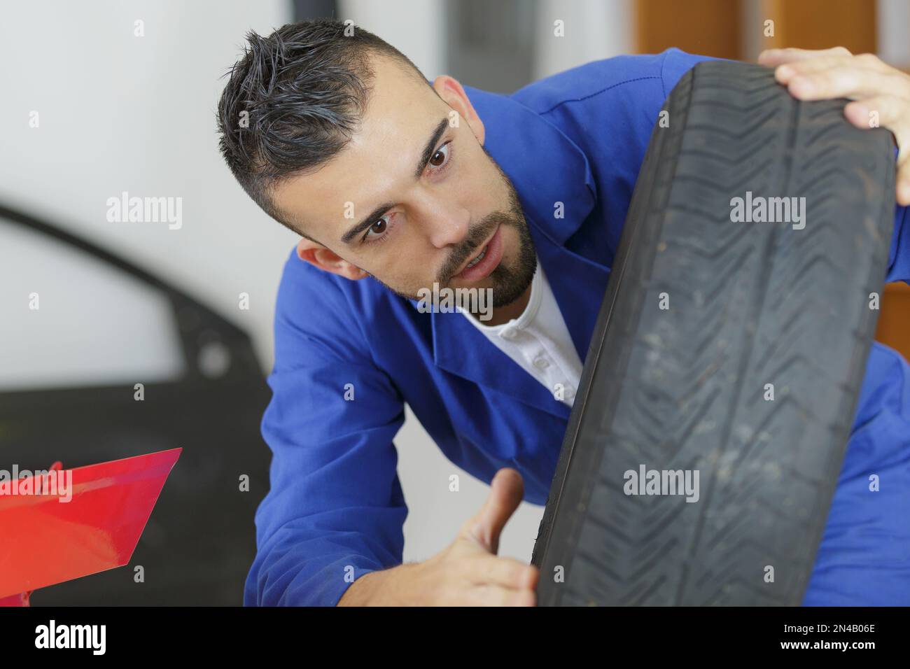 Man with a tyre hi-res stock photography and images - Alamy