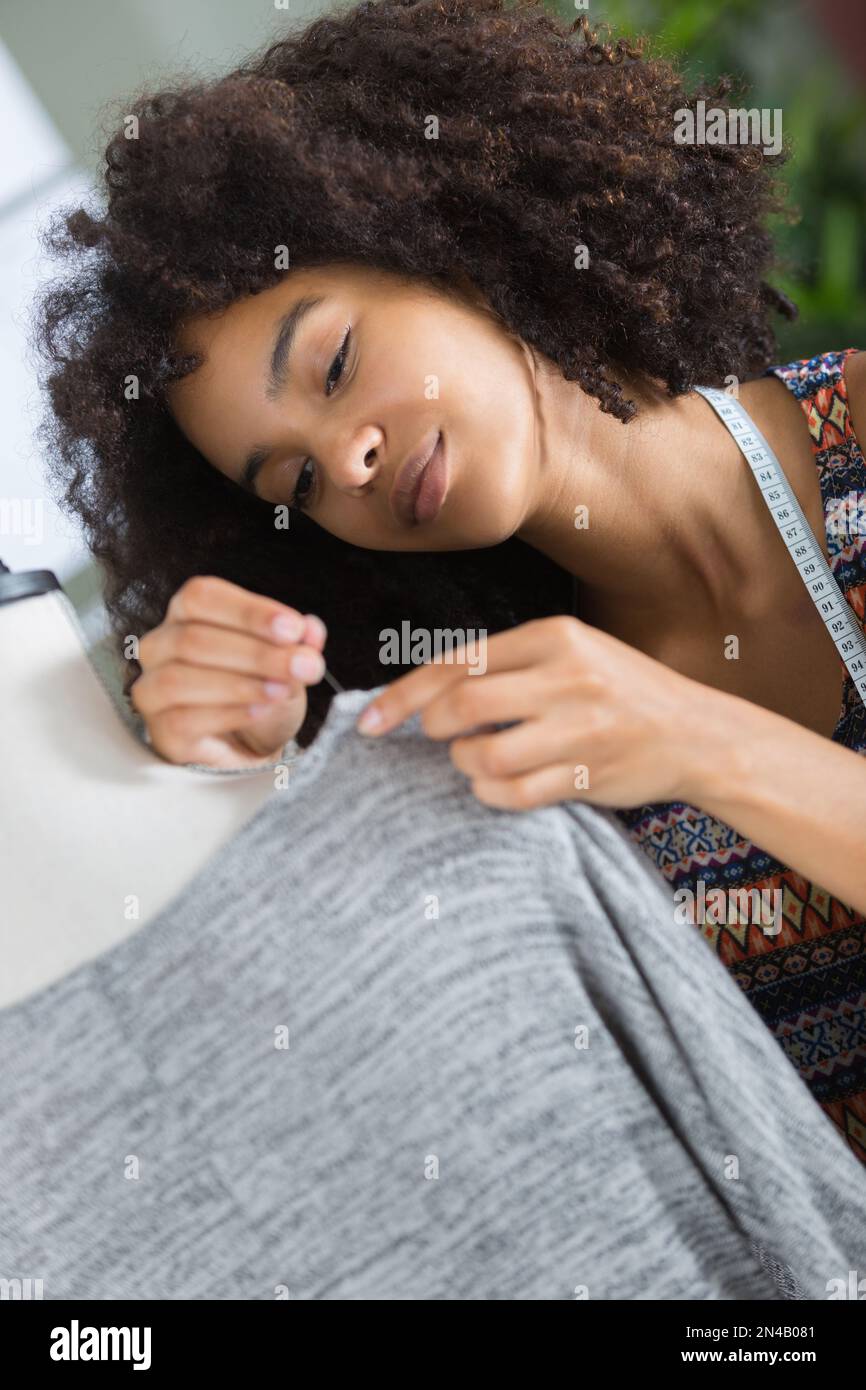 seamstress putting pin on the clothing Stock Photo - Alamy