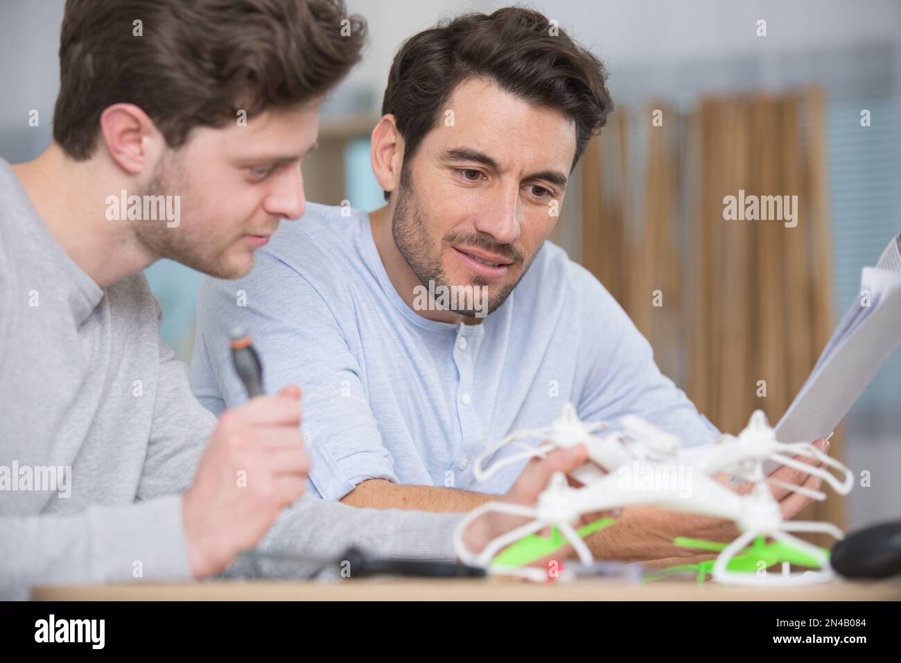 Men following instructions hi-res stock photography and images - Alamy