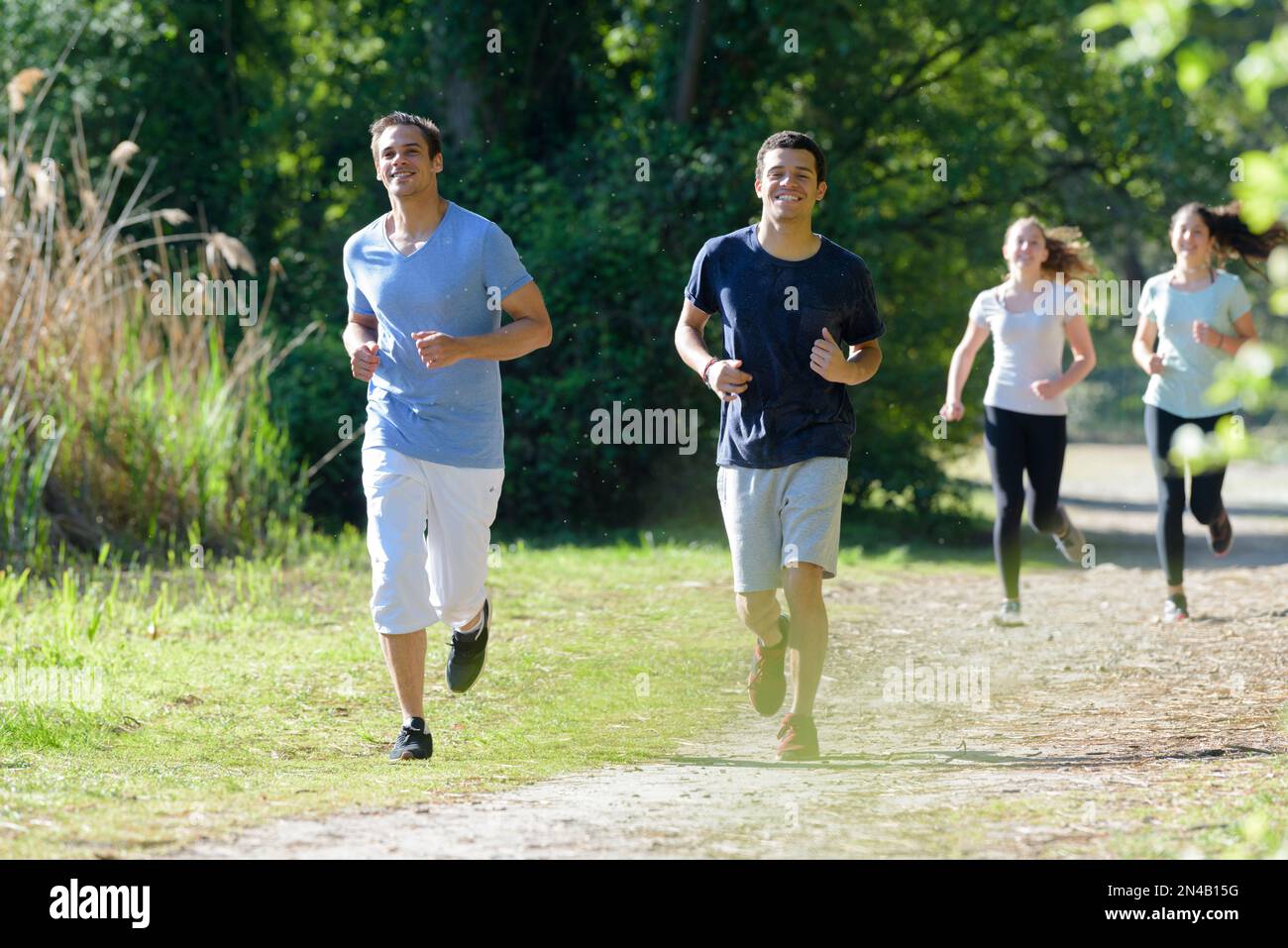 two men friends jogging outdoors Stock Photo - Alamy