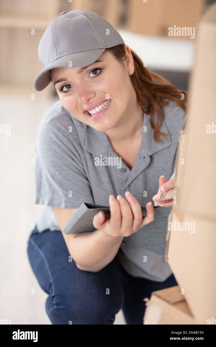 Female delivery service happily hi-res stock photography and images - Alamy