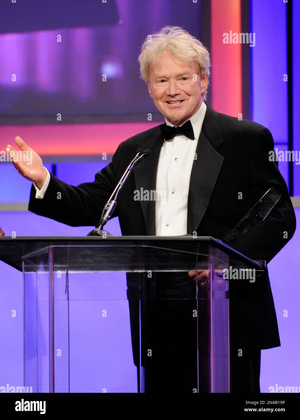 Chris Gifford, left, accepts the award for best children’s programming ...