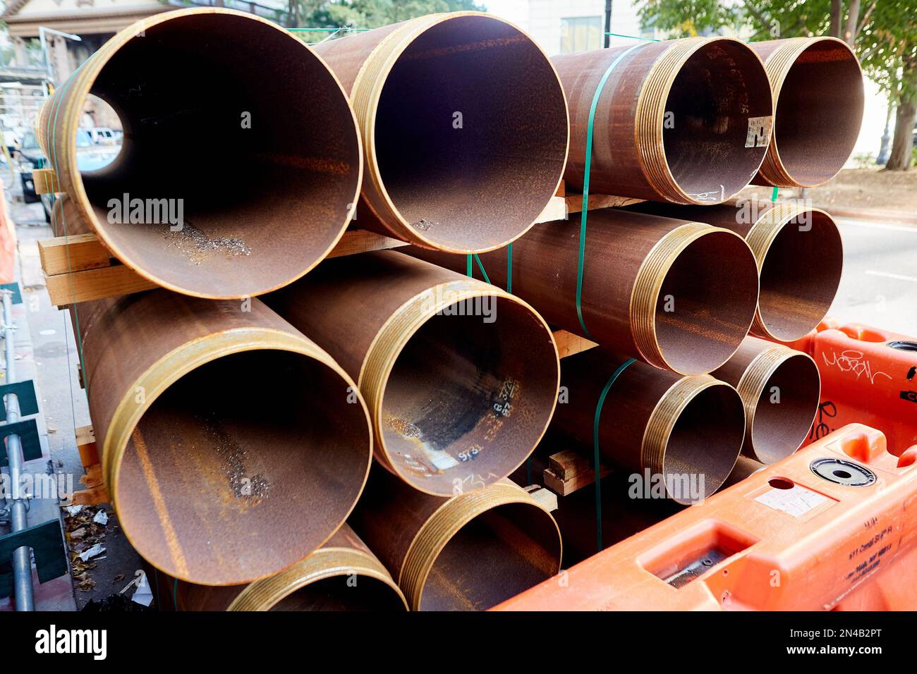 Rusted Pipes with Threaded Ends in Stacks with Green Straps on ...