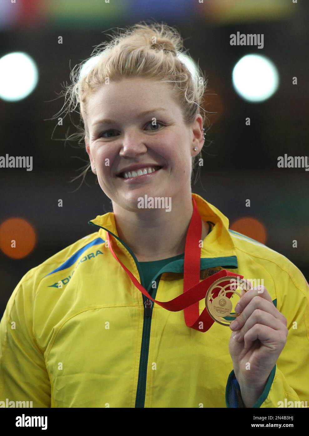 Dani Samuels of Australia holds up her gold medal as she poses for ...