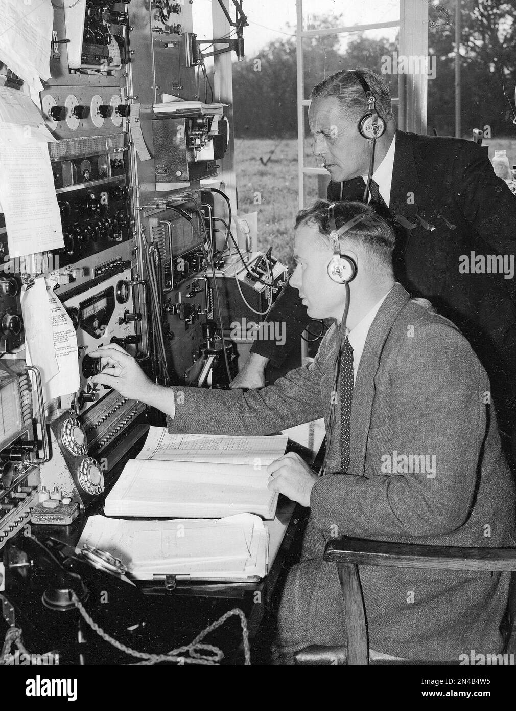 Mr. Herbert V. Griffiths, background, engineer in charge, and Mr. G.P ...