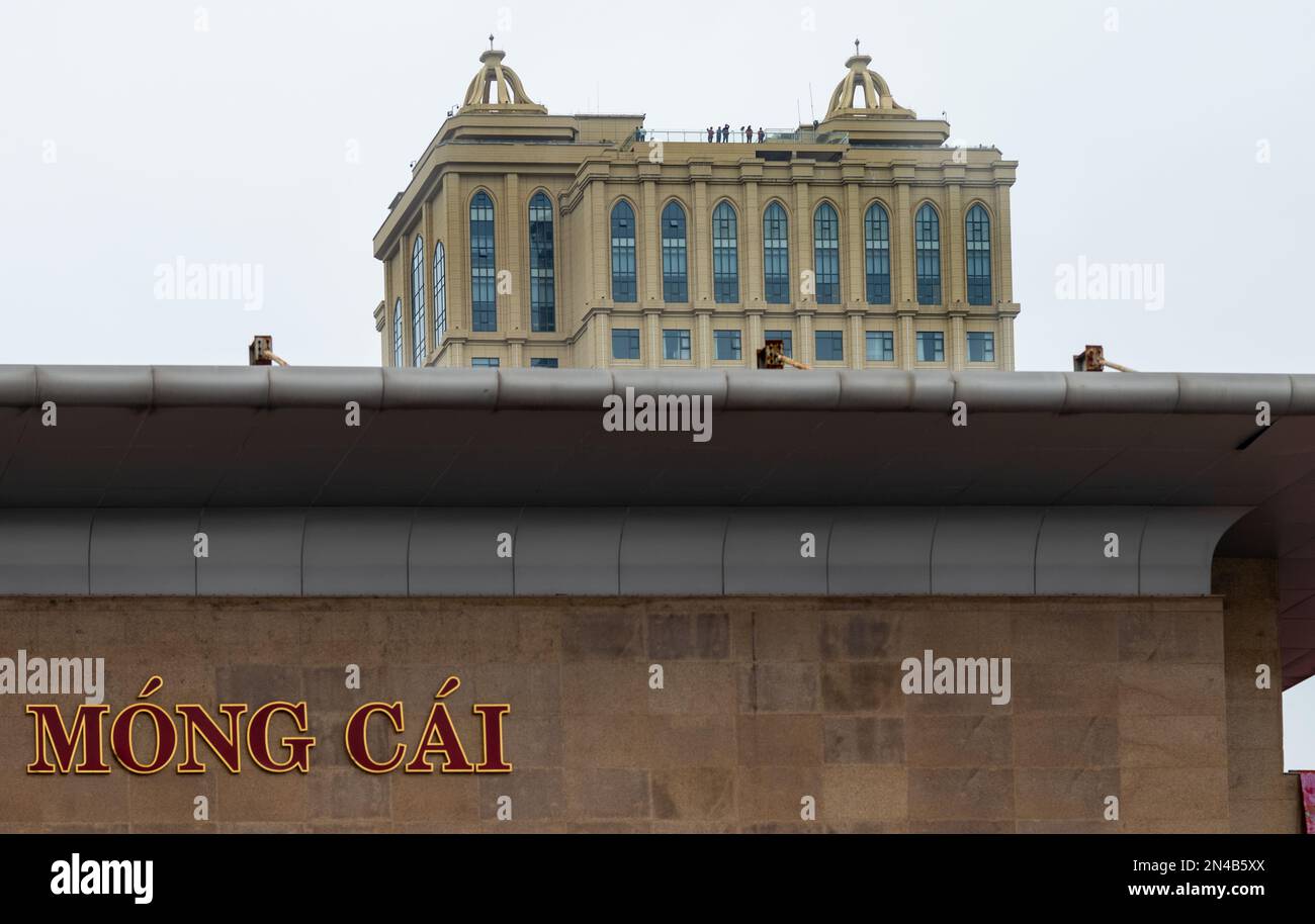 Chinese citizens stand on the roof of a tall building in China to look ...