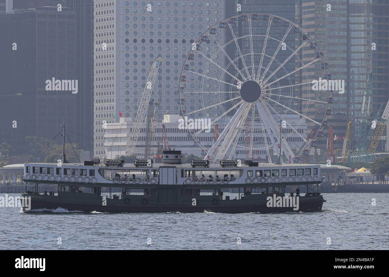 The Star Ferry sailing at Victoria Harbour in Tsim Sha Tsui. 31JAN23 ...