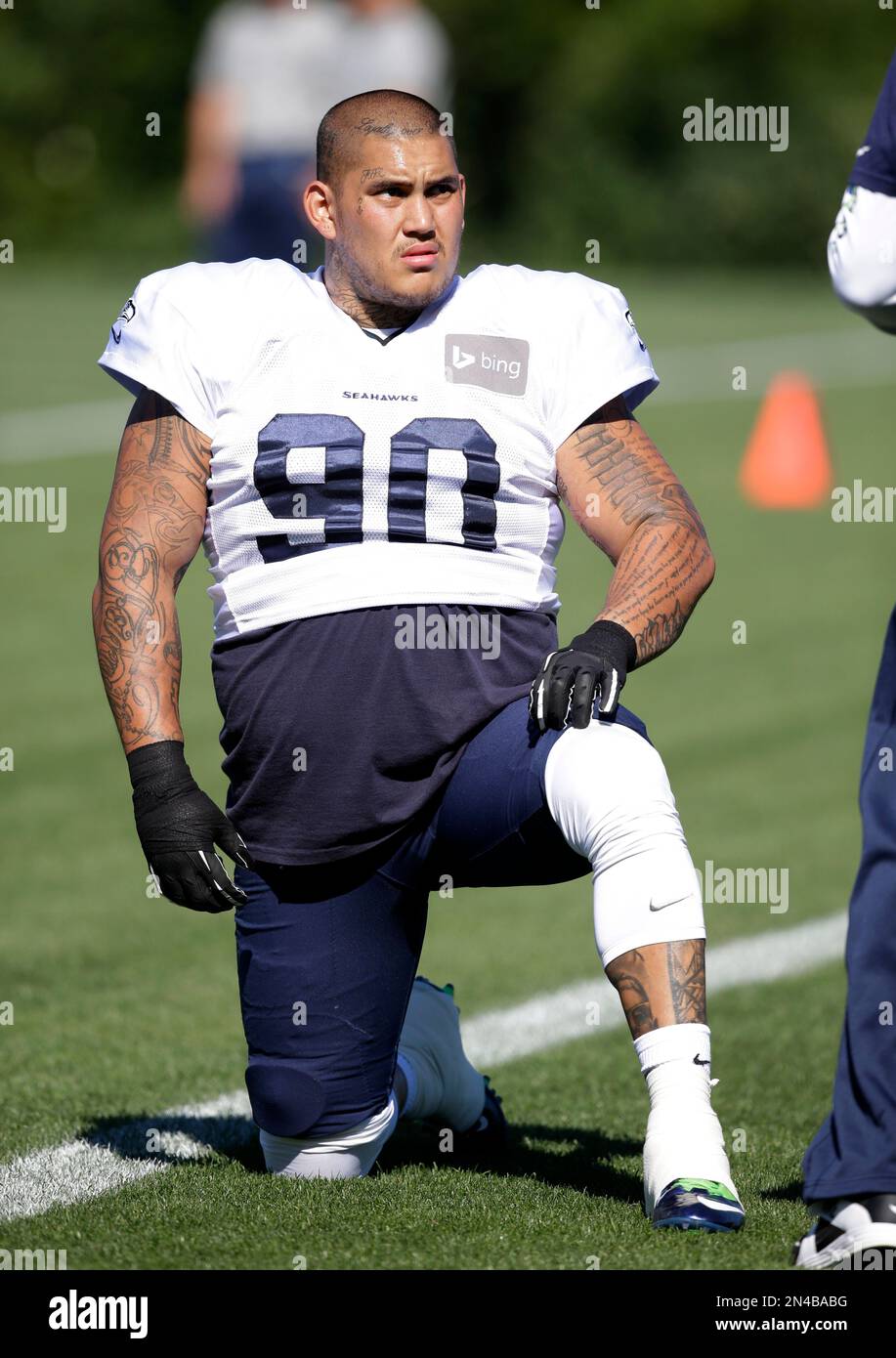 Seattle Seahawks' Jesse Williams stretches at an NFL football camp ...