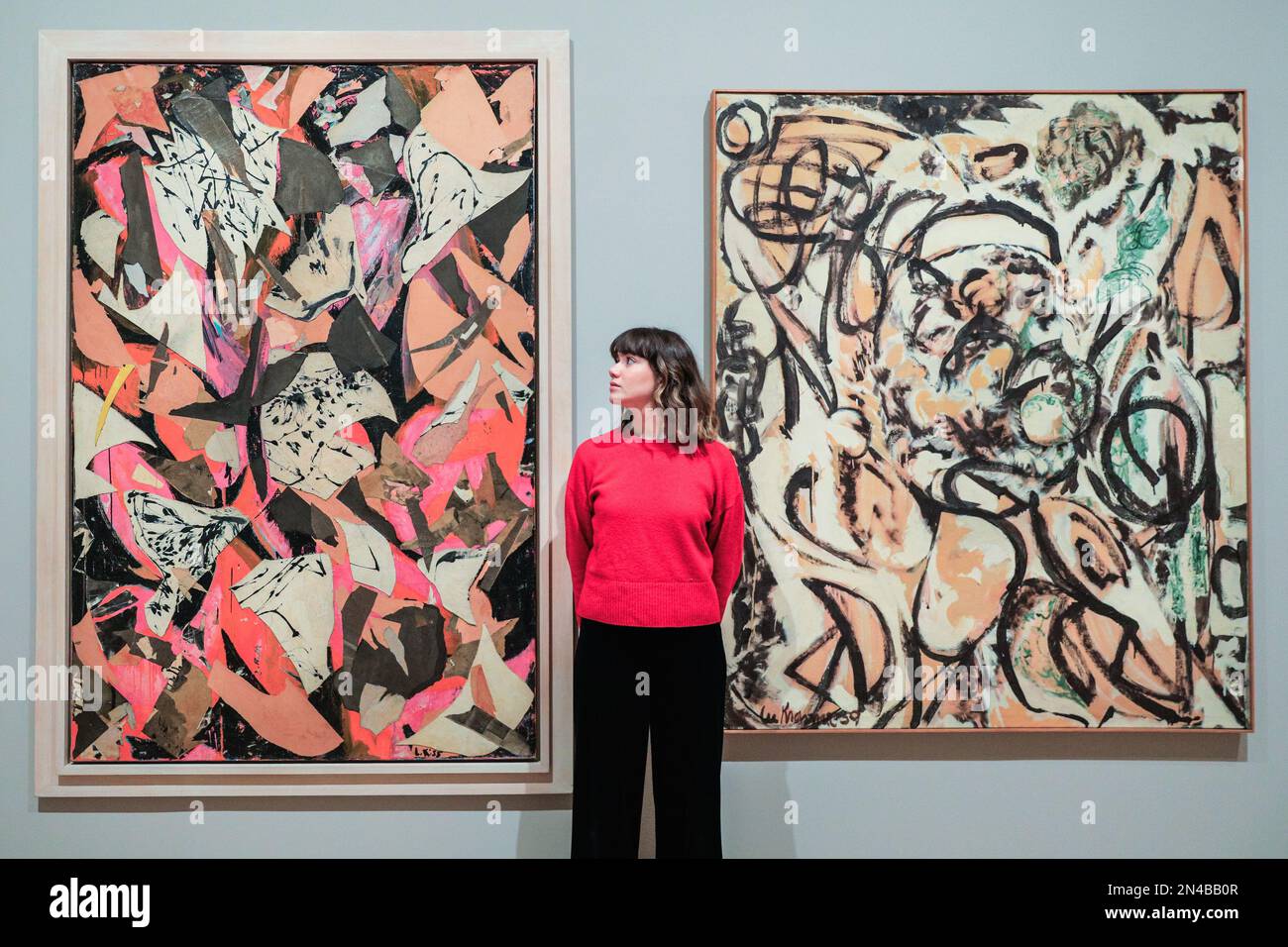 London, UK. 08th Feb, 2023. Gallery staff with Lee Krasner's 'Bald Eagle' (1955) and 'Feathering ...