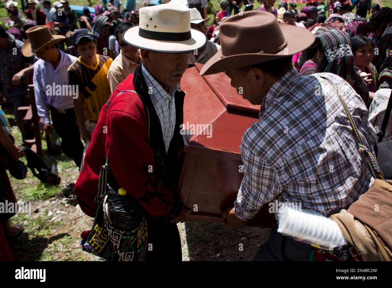 Relatives carry the coffin of one of 31 villagers massacred during the ...