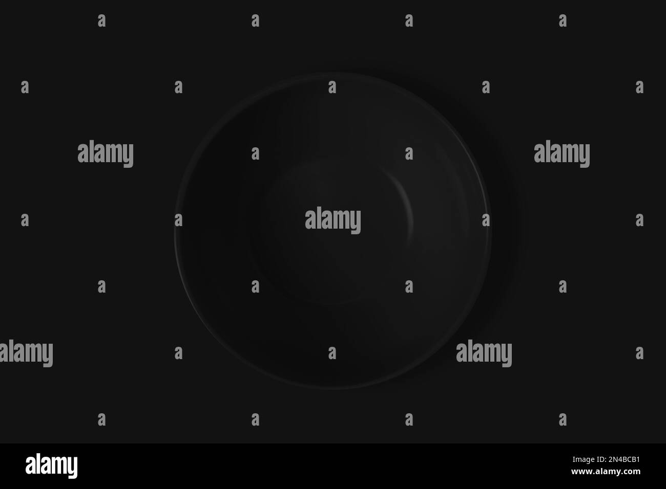 Black plate on a black background. View from above. Concept Stock Photo ...