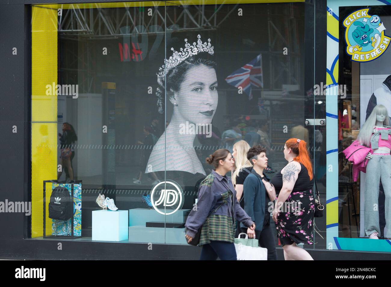 A portrait of Queen Elizabeth II is displayed in a shop window in ...