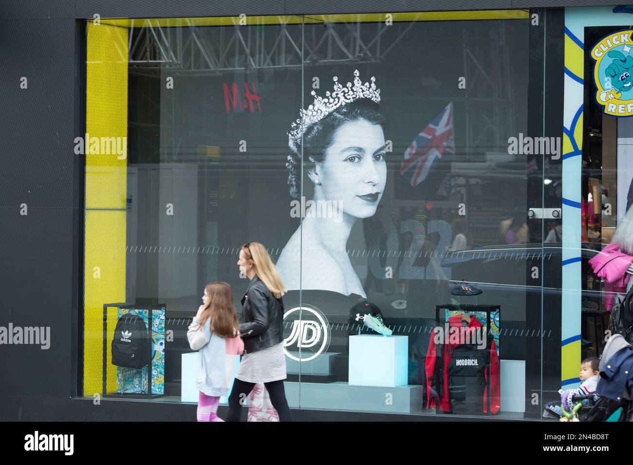 A portrait of Queen Elizabeth II is displayed in a shop window in ...